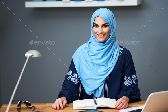 Muslim female student learning at home Stock Photo by macniak | PhotoDune