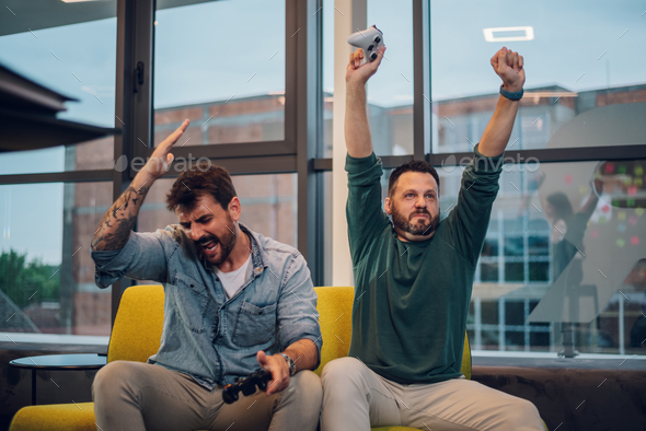 Work colleagues playing video games during their work break Stock Photo ...
