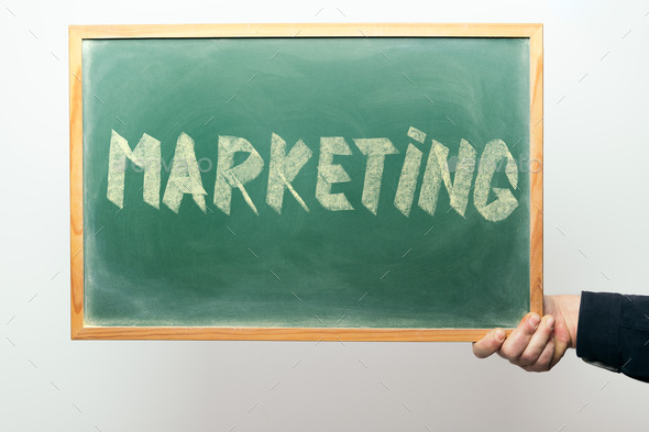 chalkboard with MARKETING handwritten in chalk Stock Photo by Raul_Mellado