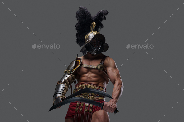 Shot of muscular gladiator with dual swords and plumed helmet Stock ...
