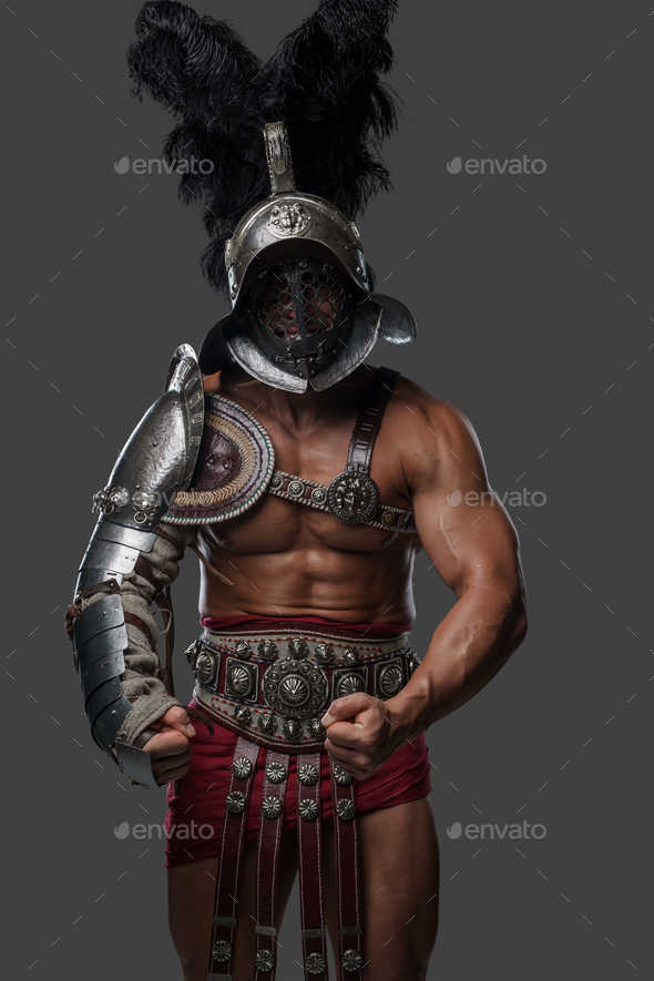 Strong roman gladiator dressed in light armor and plumed helmet Stock ...