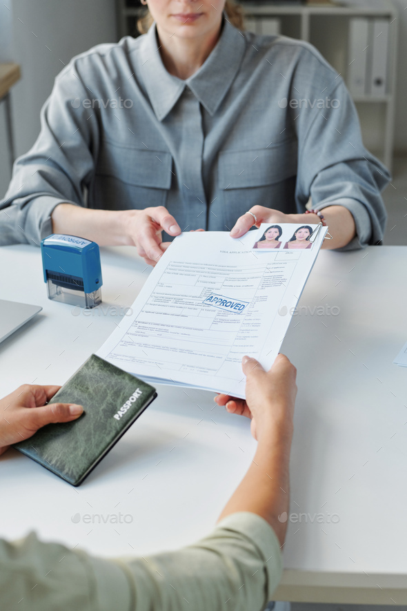 Consular Officer Giving Documents Back Stock Photo by AnnaStills ...
