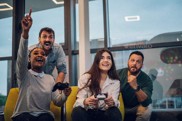 Work colleagues playing video games during their work break Stock Photo ...