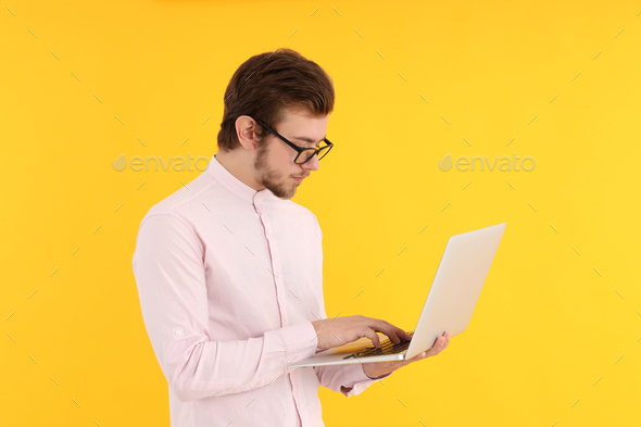 Concept of people, young man on yellow background Stock Photo by ...