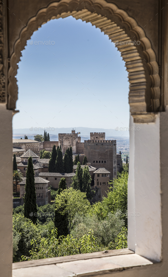 One of the windows of Generalife Alhambra with the Alambra in the ...