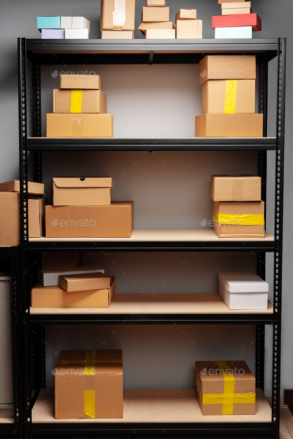 Rows of shelves with cardboard boxes in modern warehouse Stock Photo by ...
