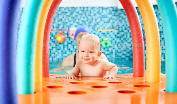 Baby having fun in the swimming pool Stock Photo by anatoliy_gleb ...