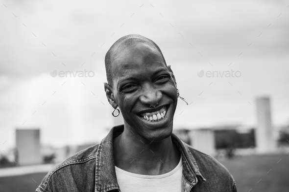 Happy african man smiling on camera outdoor - Focus on face - Black and ...