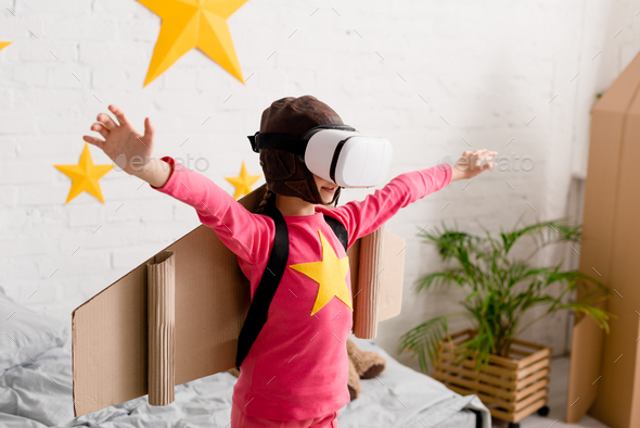 Excited kid in vr headset having fun in bedroom Stock Photo by ...