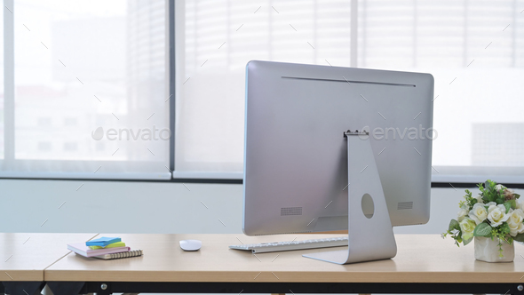 Modern workplace with computer pc, potted plant and sticky notes on ...