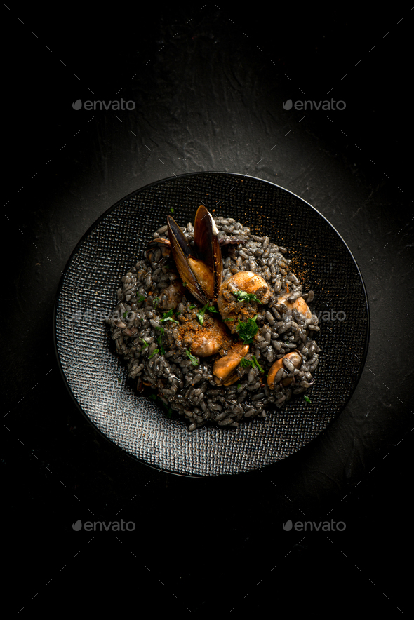 risotto with black ink squid shrimp mussels and bottarga eggs Stock ...