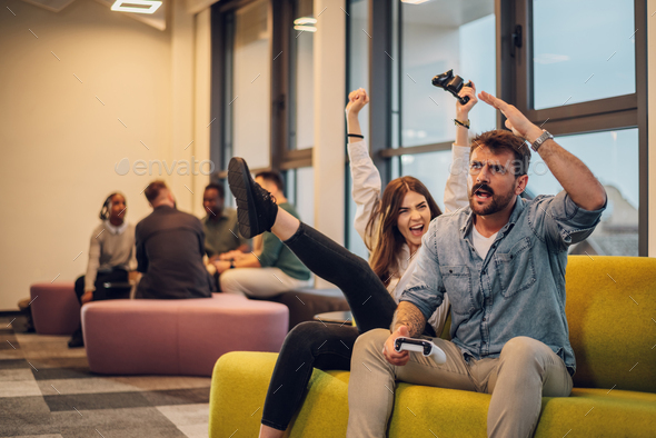 Work colleagues playing video games during their work break Stock Photo ...