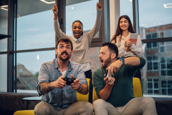 Work colleagues playing video games during their work break Stock Photo ...