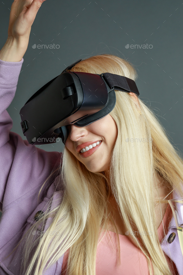 Close-up photo of smiling young girl wearing VR glasses Stock Photo by 13people