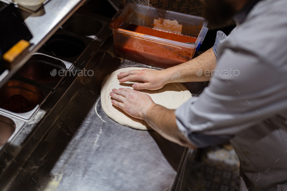 Male chef hands making pizza in the pizzeria kitchen Stock Photo by ...