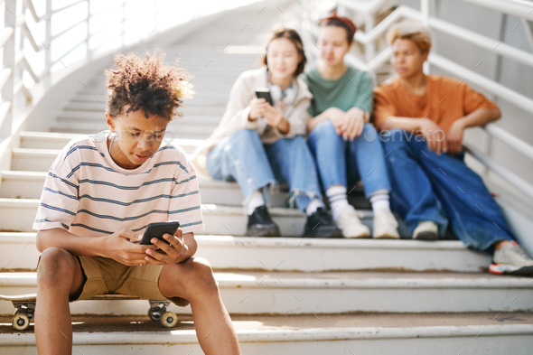 Gen Z with Smartphones Outdoors Stock Photo by seventyfourimages ...