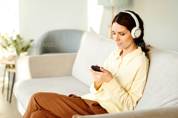 Choosing Playlist To Listen Stock Photo by seventyfourimages | PhotoDune