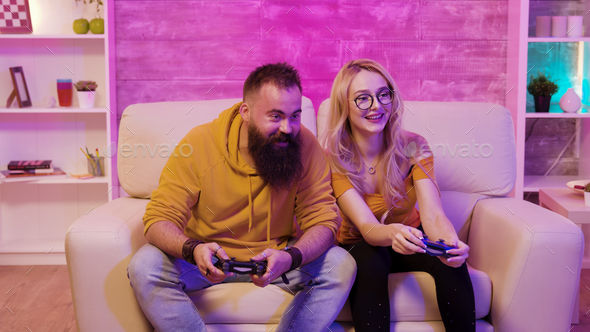 Female gamer playing online video games with her boyfriend Stock Photo ...