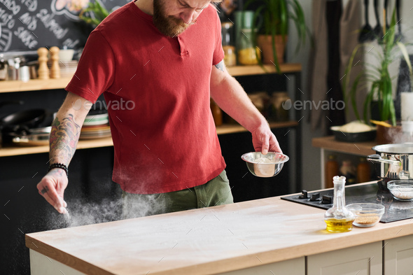 Man Dusting Table With Flour Stock Photo by AnnaStills | PhotoDune