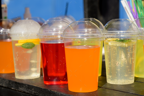 Different colors of cold water in a plastic cup. Stock Photo by ...