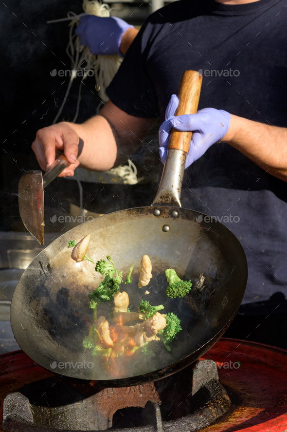 Chef cooks Chinese noodle wok at street food festival Stock Photo by ...