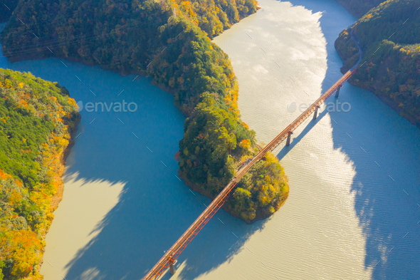The steam train crossing Oigawa Railroad to go to station and blue ...
