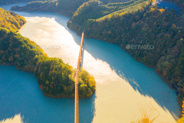 The steam train crossing Oigawa Railroad to go to station and blue ...