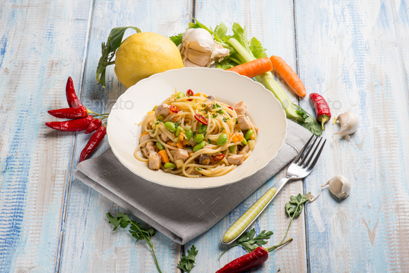 spaghetti with sword fish carrot brad beans and hot chili pepper Stock ...