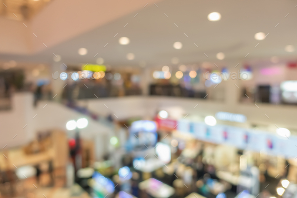 Abstract bokeh blurry background of retail shops in shopping mall or ...