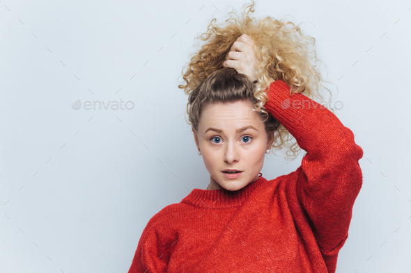 Female in red sweater, poses with stunned expression, dressed in red ...