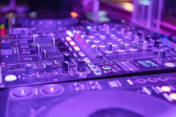 Mixes on CD players or track at nightclub during party for DJ ...