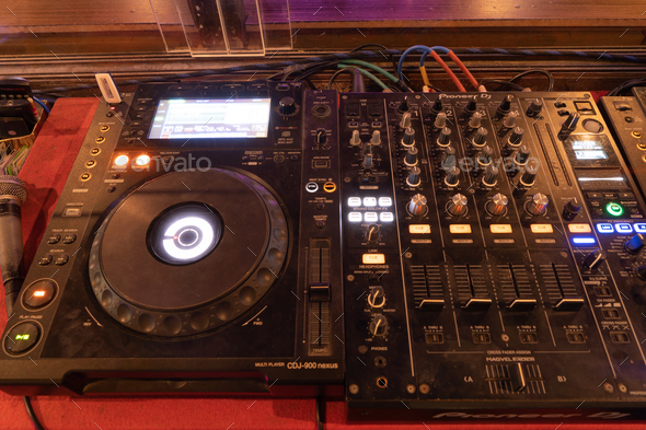 Mixes on CD players or track at nightclub during party for DJ ...