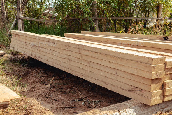 Wood planks stacked on top of each other in the warehouse Stock Photo ...