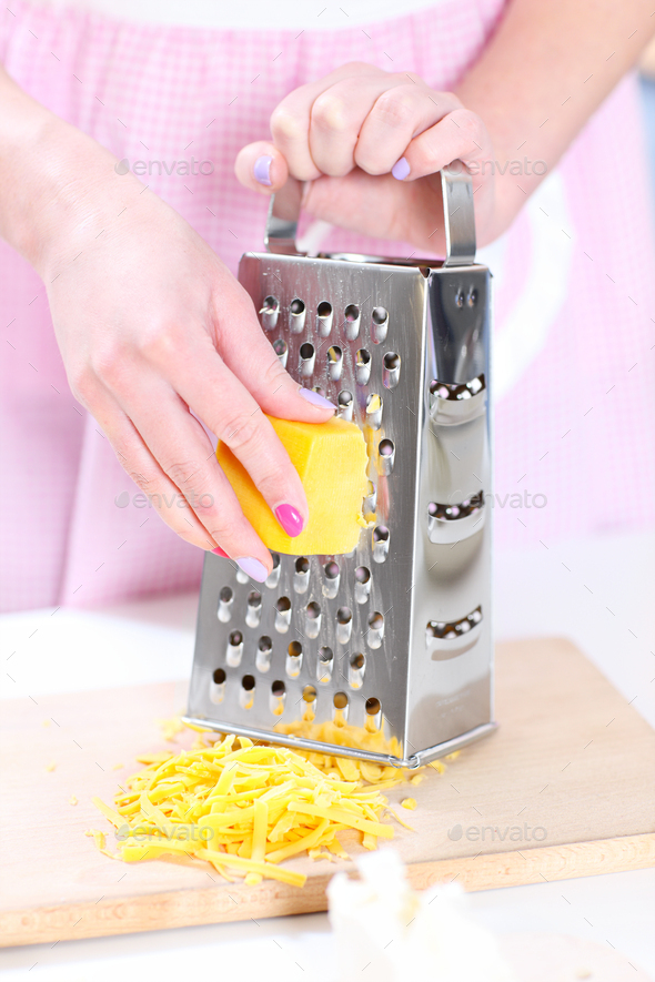 Grating cheese Stock Photo by macniak | PhotoDune