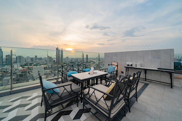 Sky bar, a restaurant or cafe lounge terrace with dinner table on ...