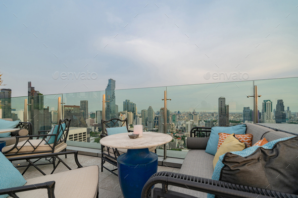 Sky bar, a restaurant or cafe lounge terrace with dinner table on ...