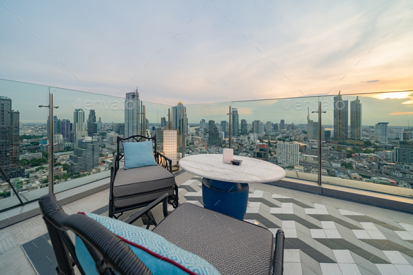 Sky bar, a restaurant or cafe lounge terrace with dinner table on ...
