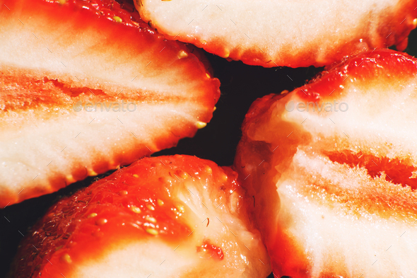 strawberry cut in half. strawberry core. half of a strawberry on a ...