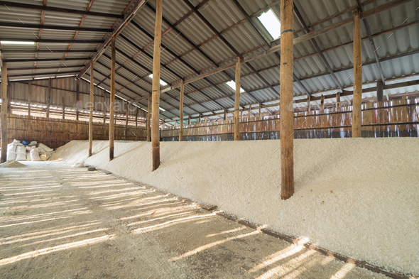 Raw sea salt heap inside traditional local wooden storage barn. Nature ...