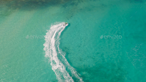 Jet ski or boat drawing a shape on sea ocean turquoise water. Adventure ...