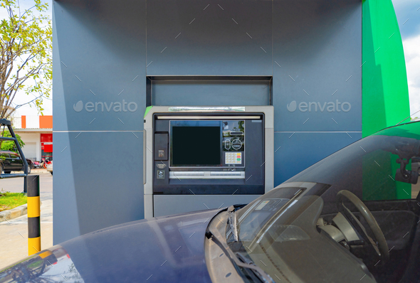 ATM drive through machine with a car, screen at service station. Cash ...