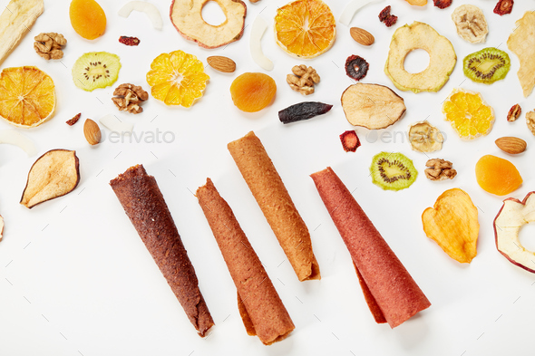 Neatly stacked fruit lozenge different colors and nuts. Stock Photo by ...
