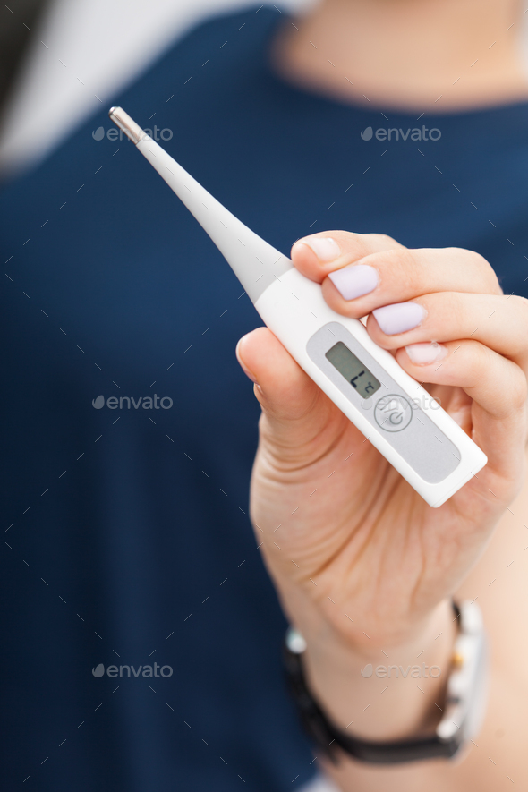 Sick women with a thermometer Stock Photo by FabrikaPhoto | PhotoDune