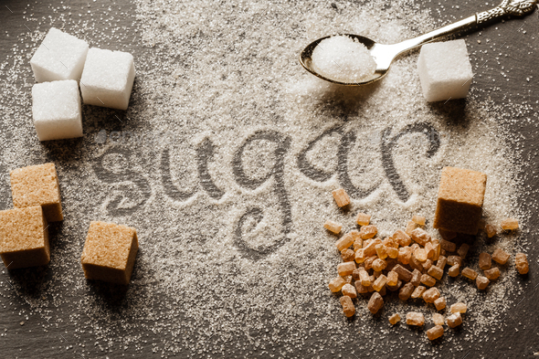 The word sugar written into a pile of white granulated sugar Stock ...