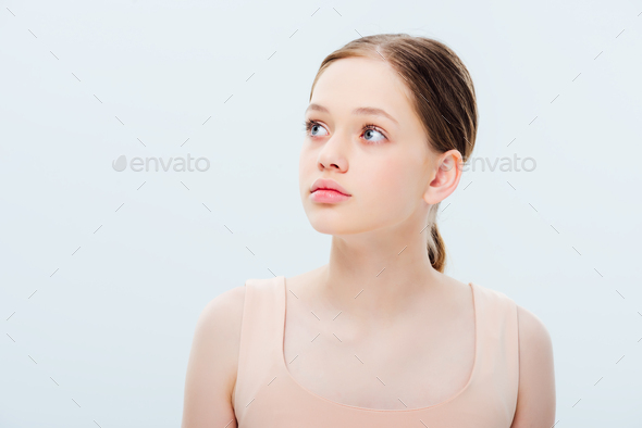 dreamy teenage girl looking away isolated on grey Stock Photo by ...