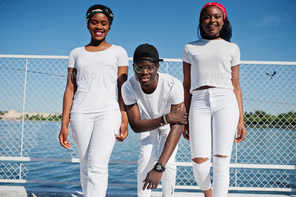 Stylish african american friends in white Stock Photo by ASphotostudio