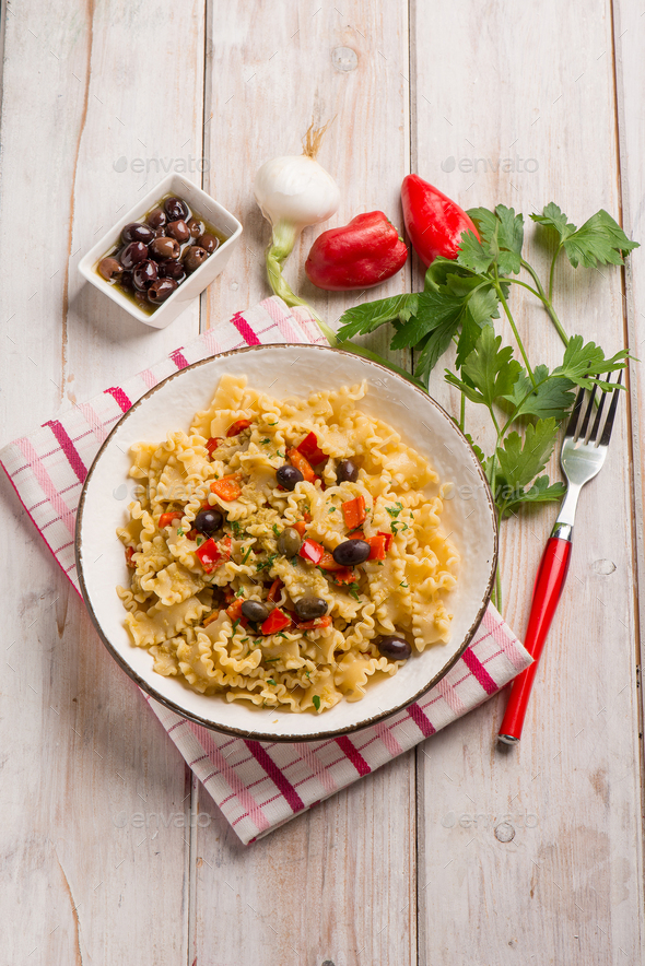 mafalde pasta with capsicum black olives and onions Stock Photo by ...