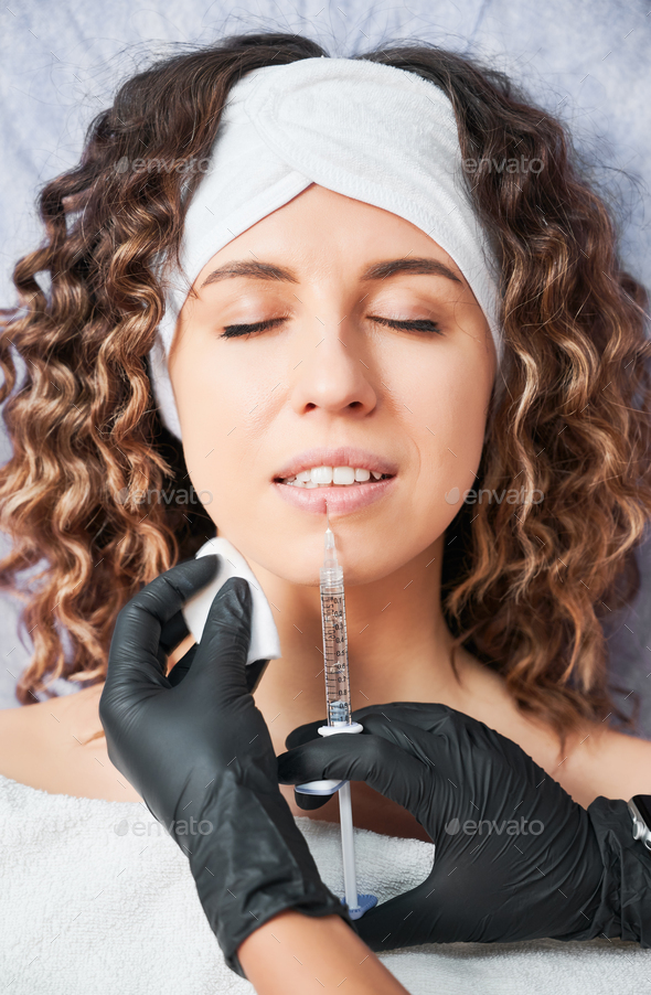 Process procedure lip augmentation in professional salon. Stock Photo ...