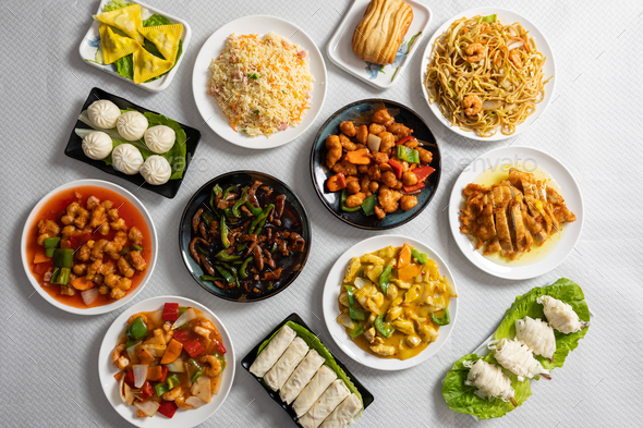 Table with Chinese food seen from above Stock Photo by jgcocinarte
