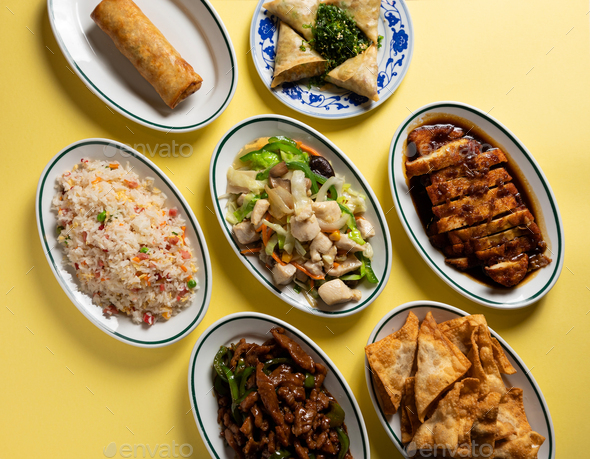 Typical Chinese food on yellow background Stock Photo by jgcocinarte